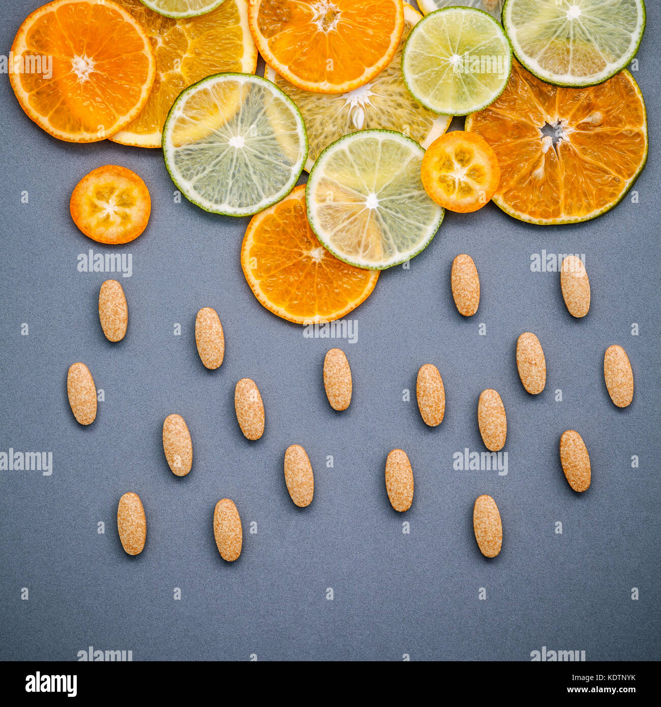 Healthy foods and medicine concept. Pills of vitamin C and various ...