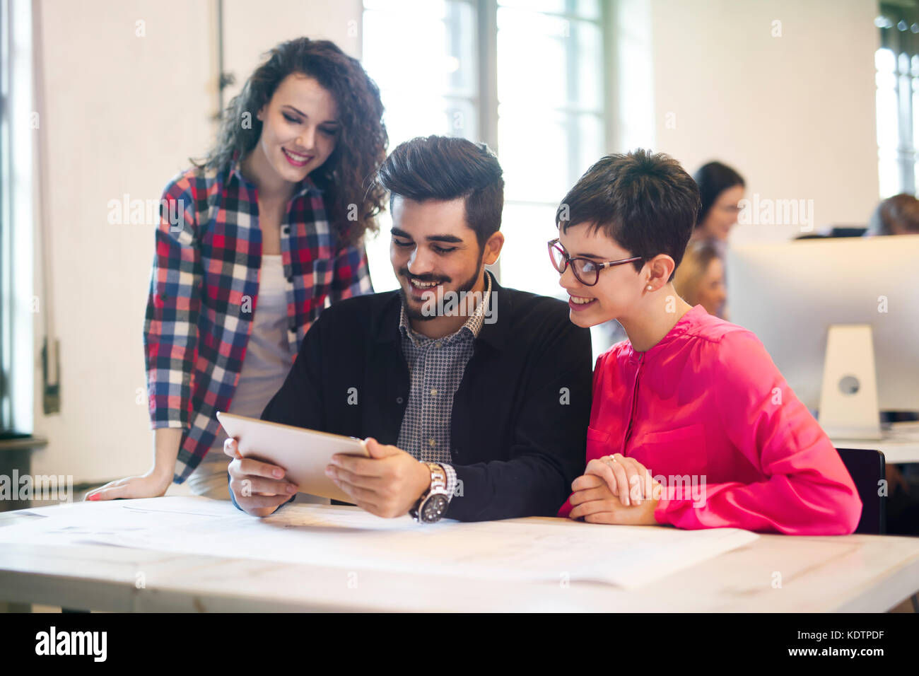 Group young colleagues using hi-res stock photography and images - Alamy