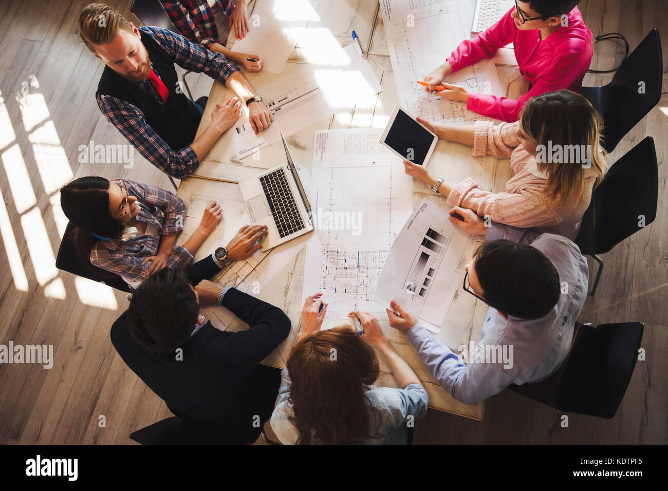 Portrait of young perspective designers having meeting Stock Photo - Alamy