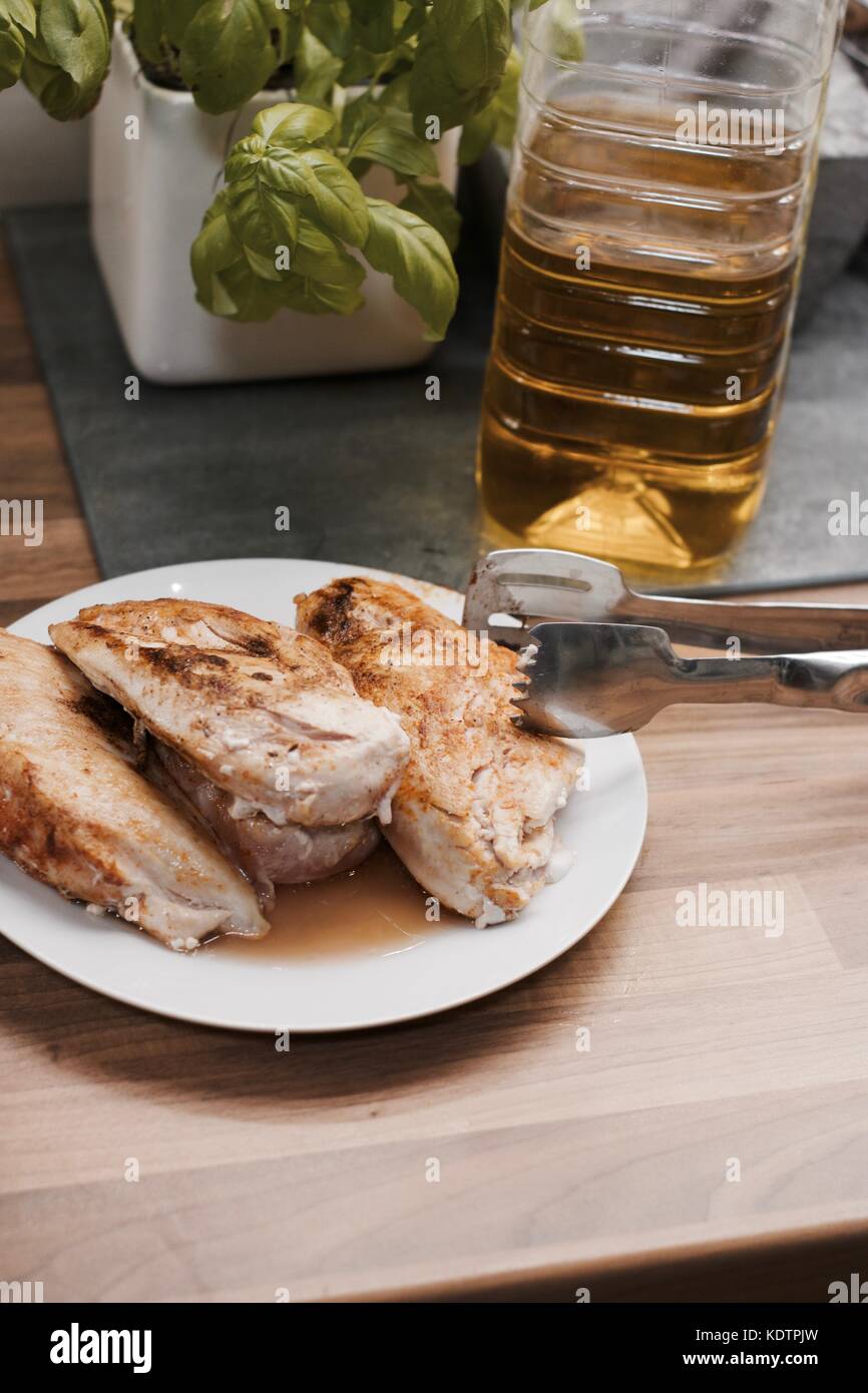 Fresh and delicious grilled chicken on white plate in the kitchen. Food ...