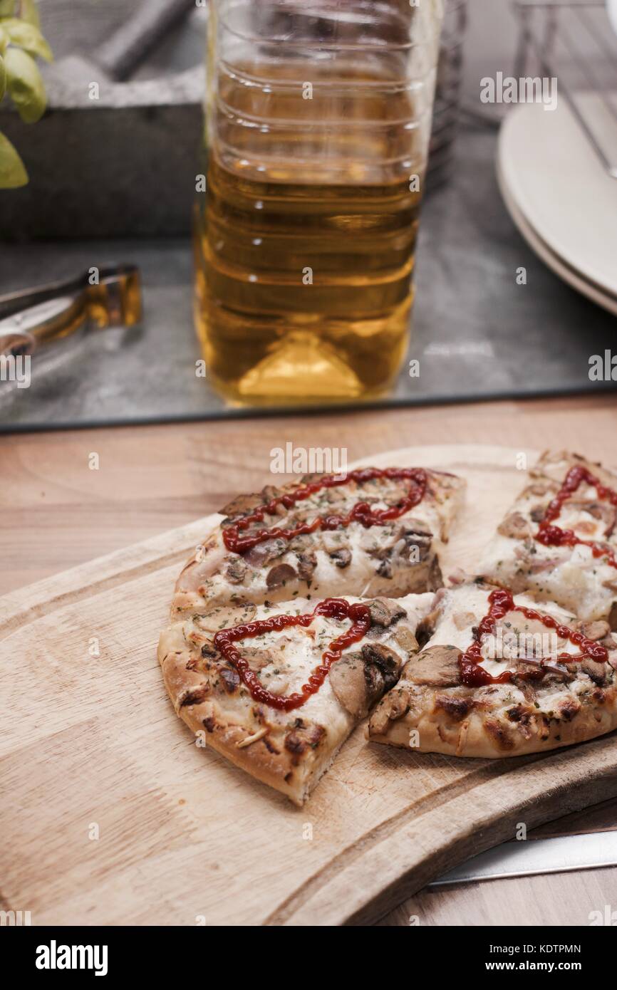 Tasty and fresh italian pizza in the kitchen on the wooden board Stock ...