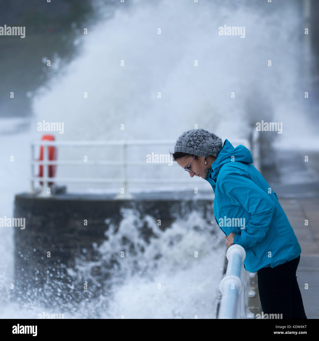 Woman leaning against railings hi-res stock photography and images - Alamy