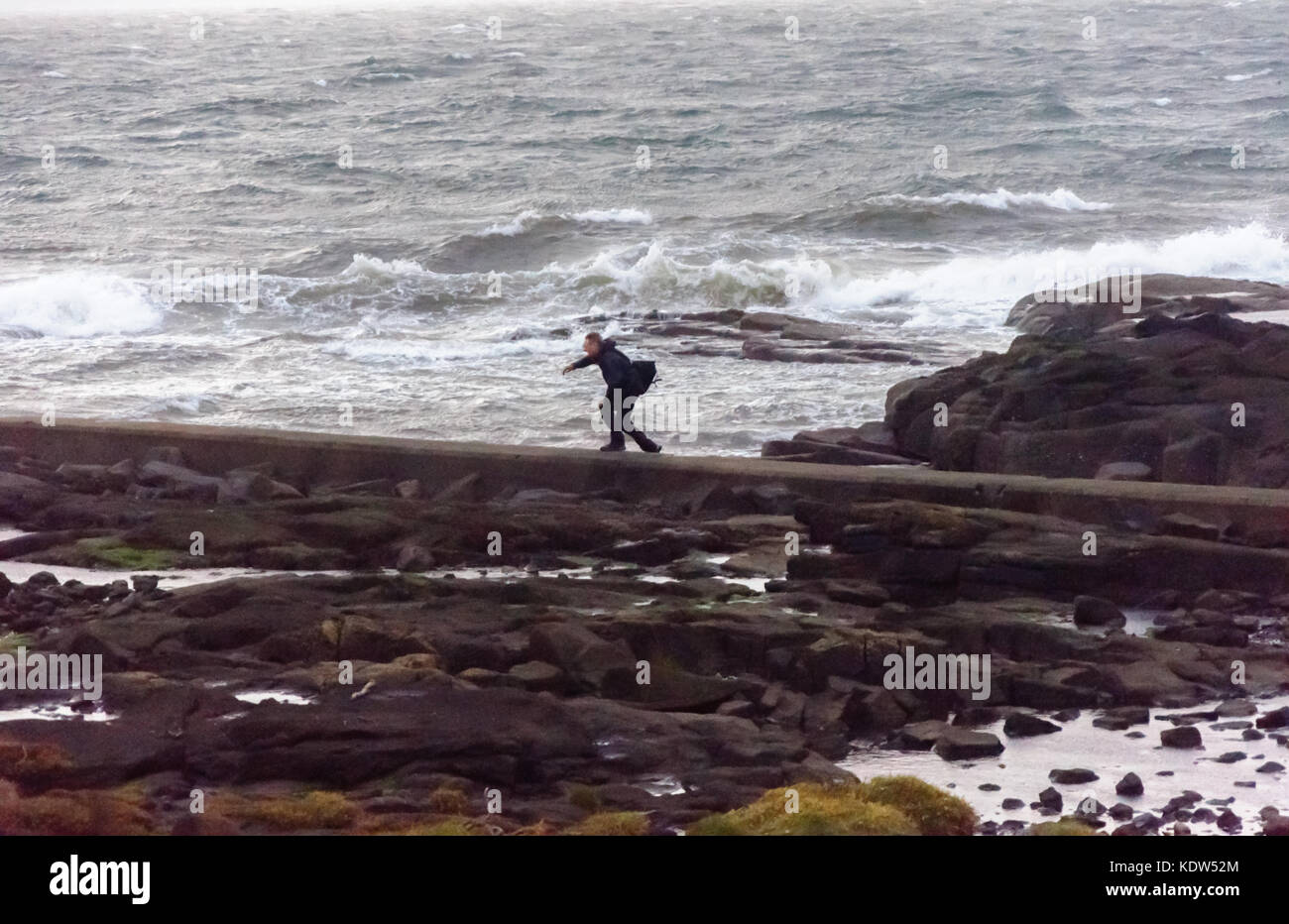 Troon, Scotland, UK. 16th October, 2017. UK Weather: A man takes a walk ...