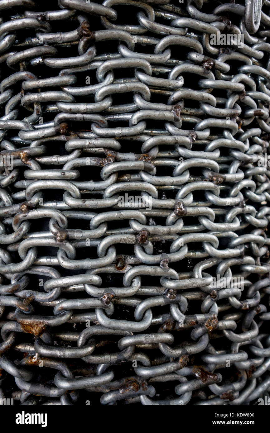 A closeup of tightly wound silver chain Stock Photo - Alamy