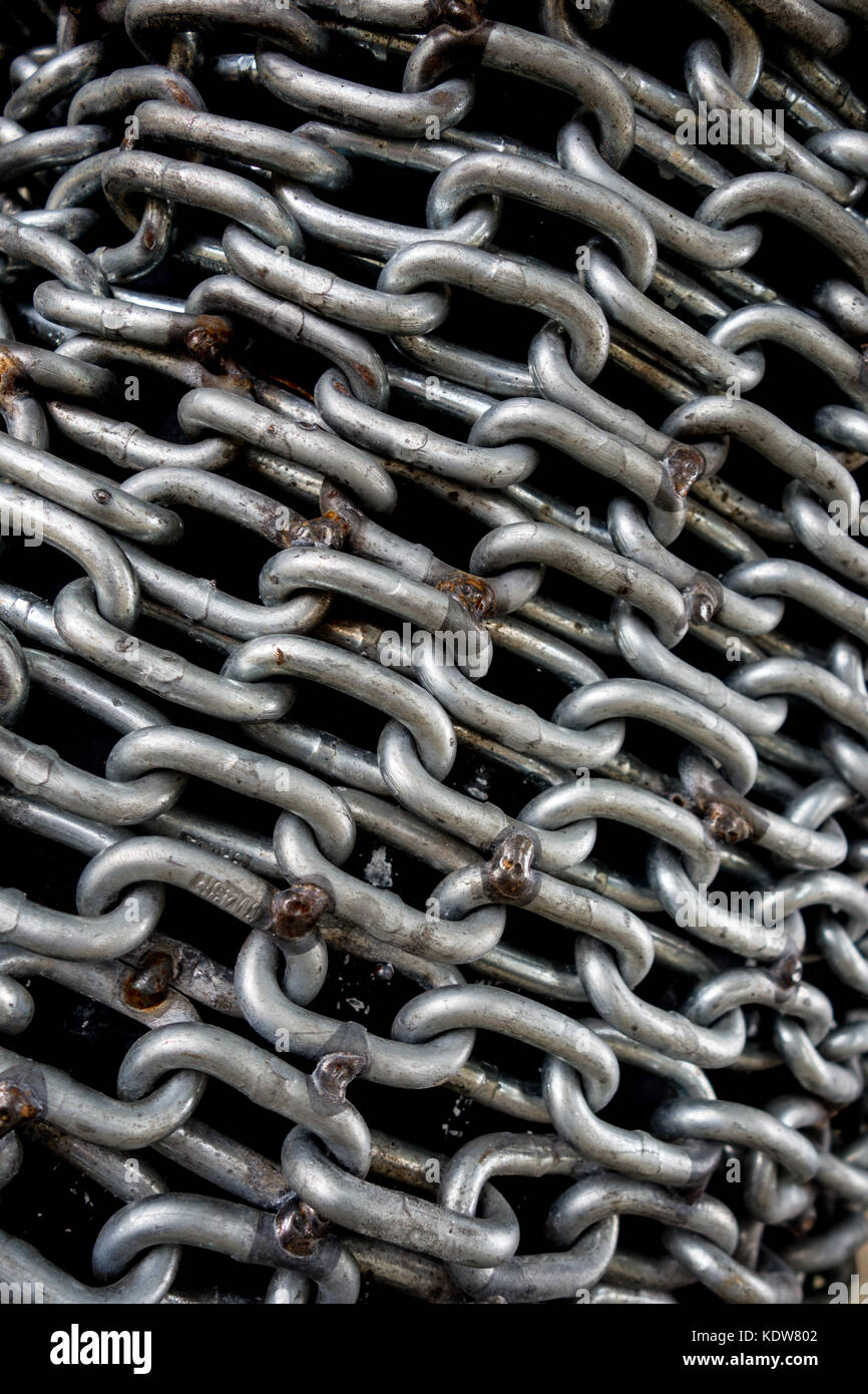 A closeup of tightly wound silver chain Stock Photo - Alamy