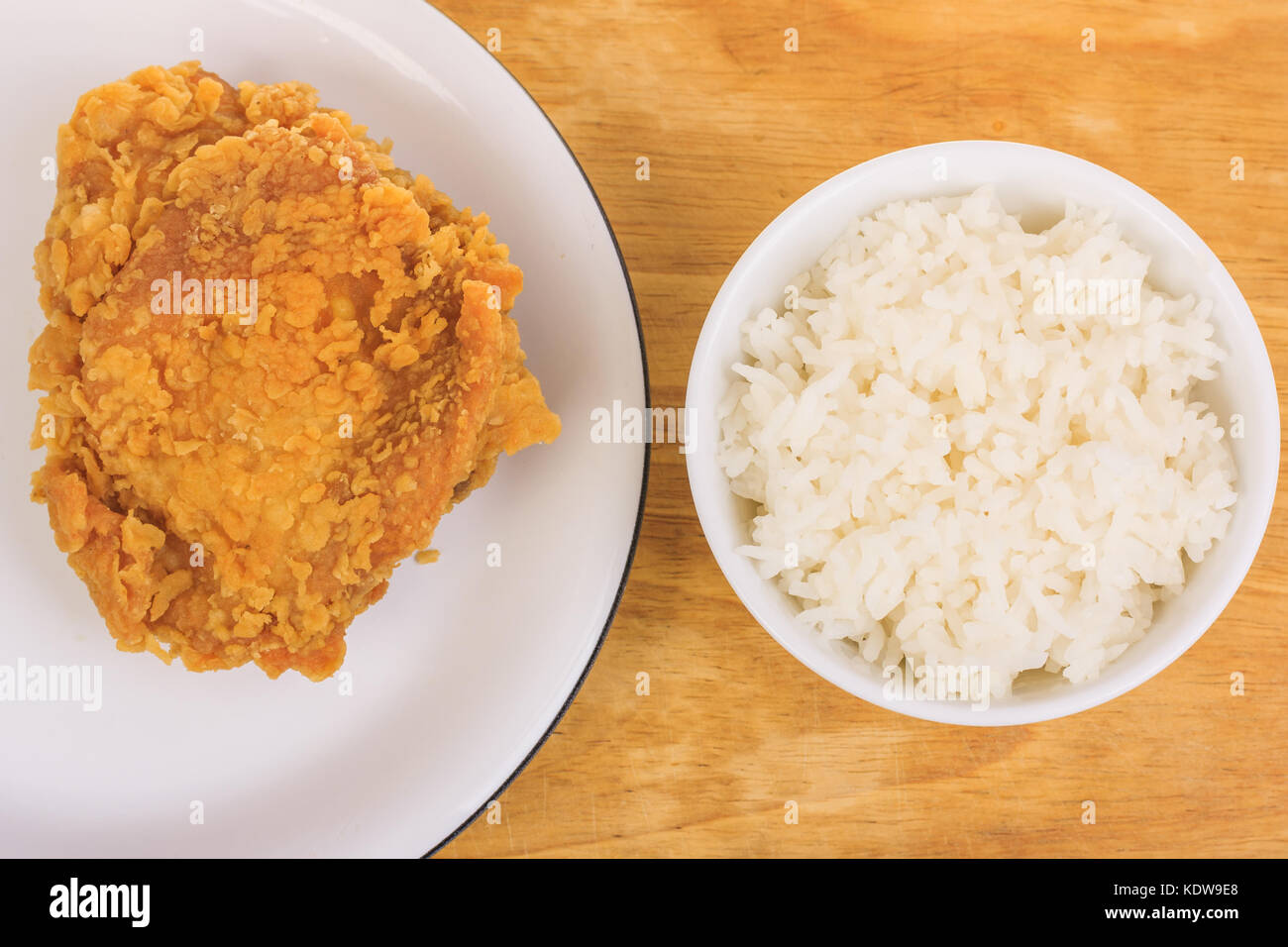 fried chicken and rice top view on wood background Stock Photo - Alamy