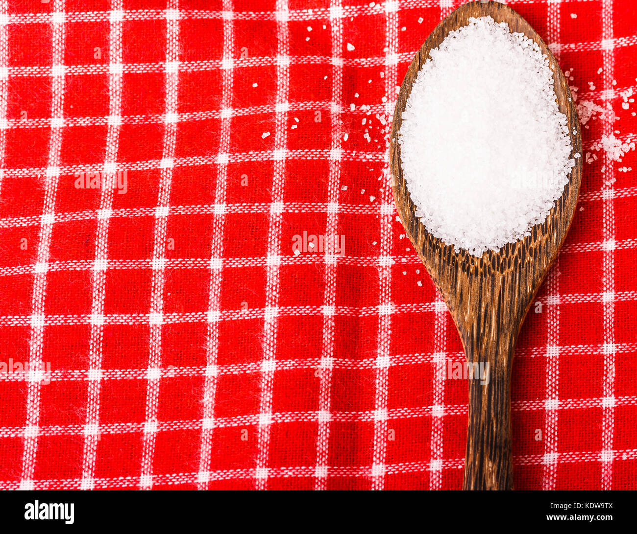 sugar on wood spoon Stock Photo - Alamy