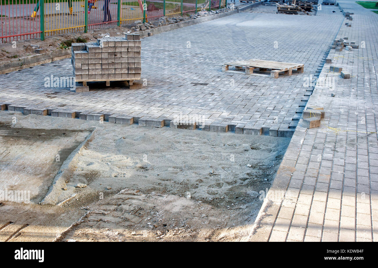 construction of a new modern road with paving slabs in the city on ...
