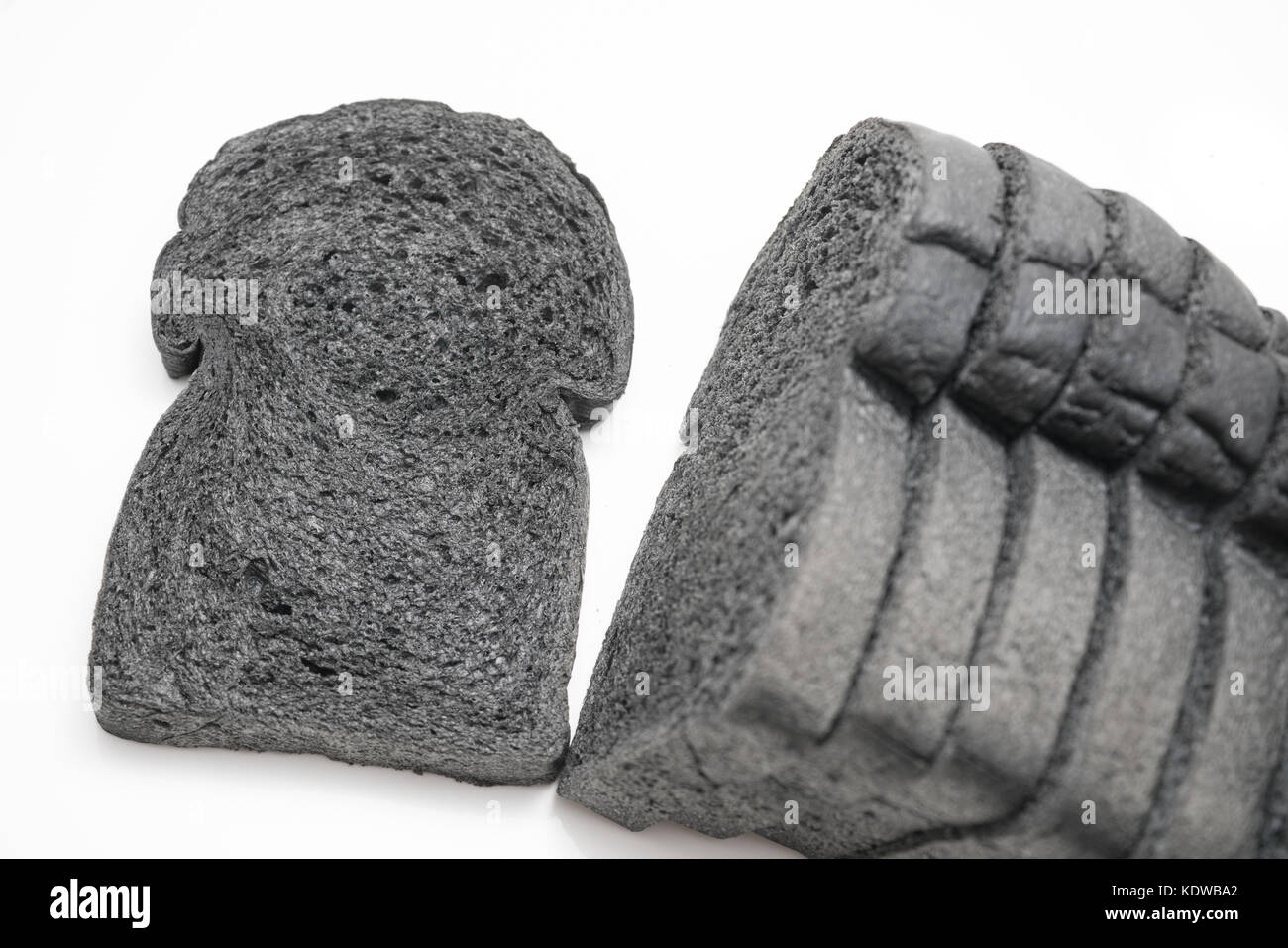 loaf slide of charcoal bread black bread isolated on white background ...
