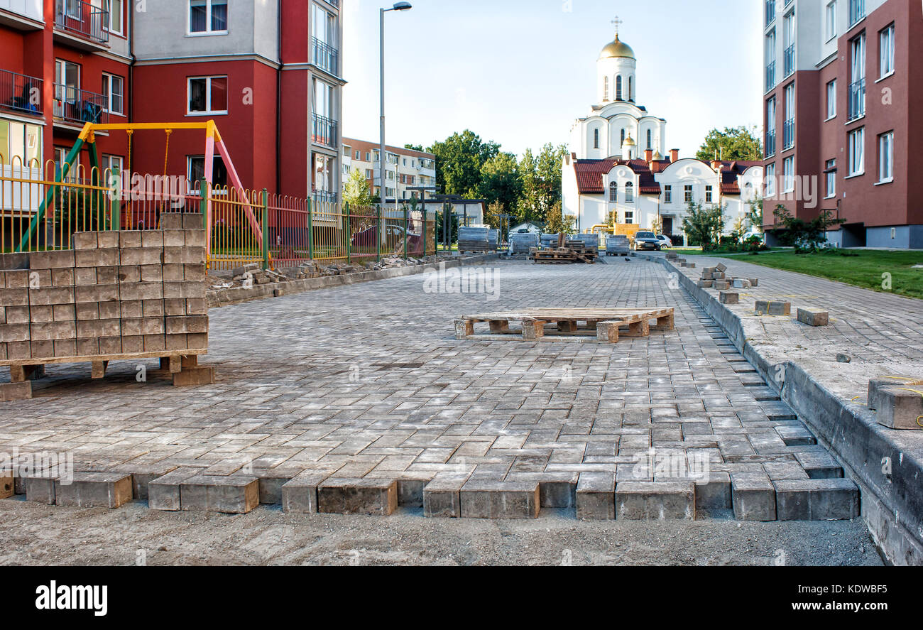 construction of a new modern road with paving slabs in the city on ...