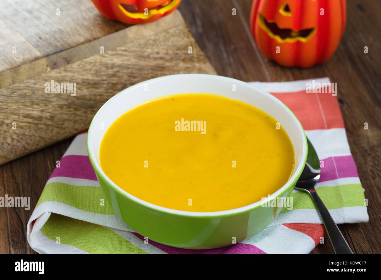 Simple plain pumpkin soup in green bowl. Homemade creamy soup of fall ...