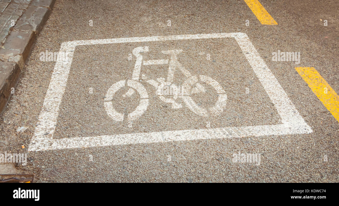 bicycle sign painted white on the road to indicate a bicycle pisa Stock ...