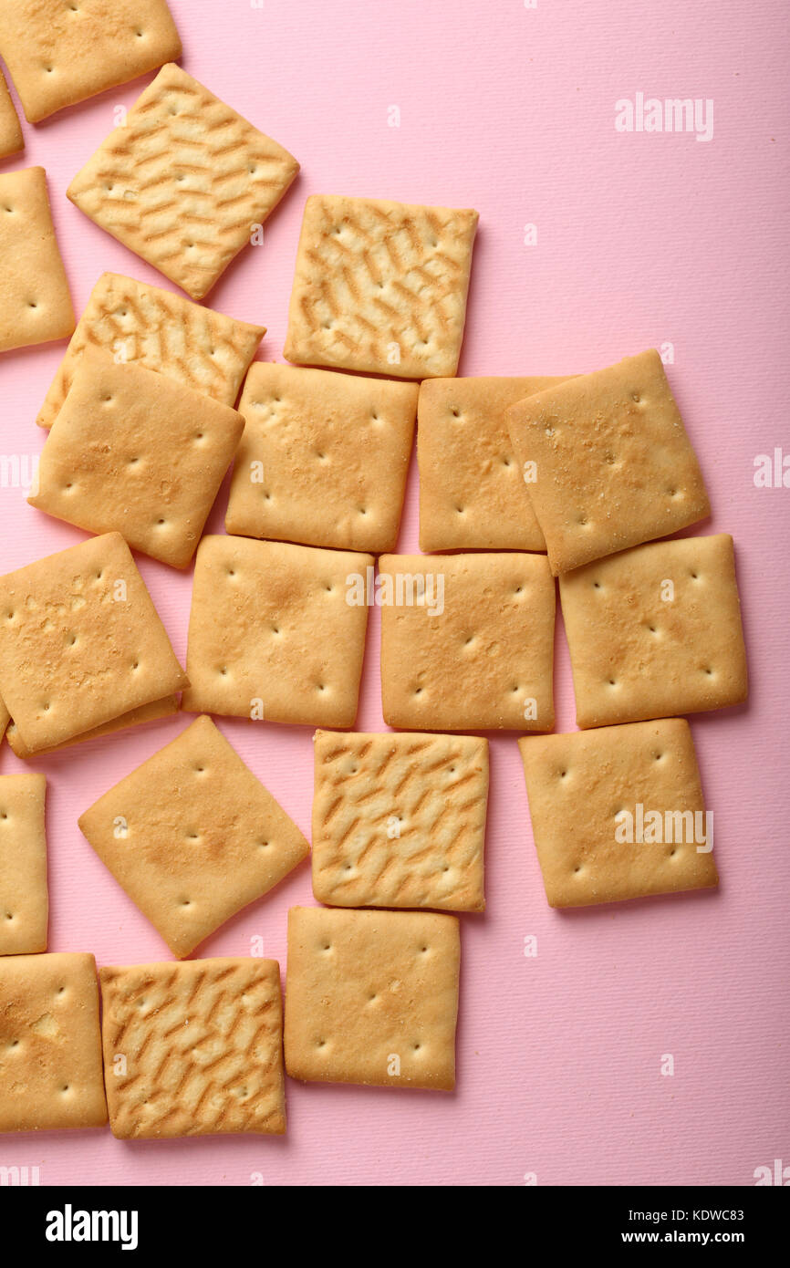Crunchy snack biscuits on pink Stock Photo - Alamy