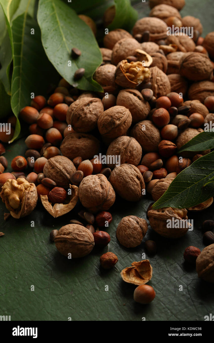 Harvest of nuts on green, healthy food Stock Photo - Alamy