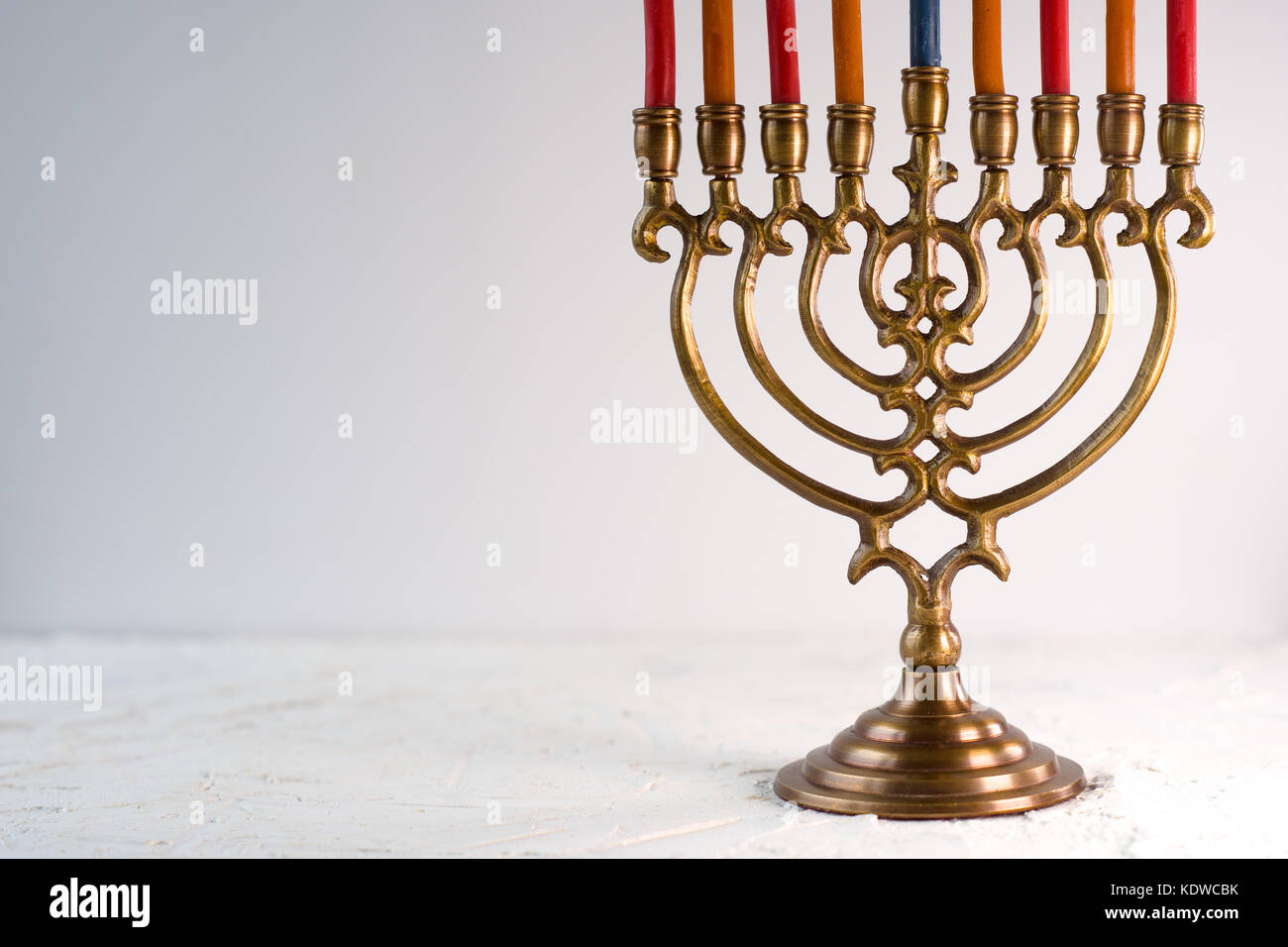 Brass hanukkah menorah with candles side view horizontal Stock Photo ...