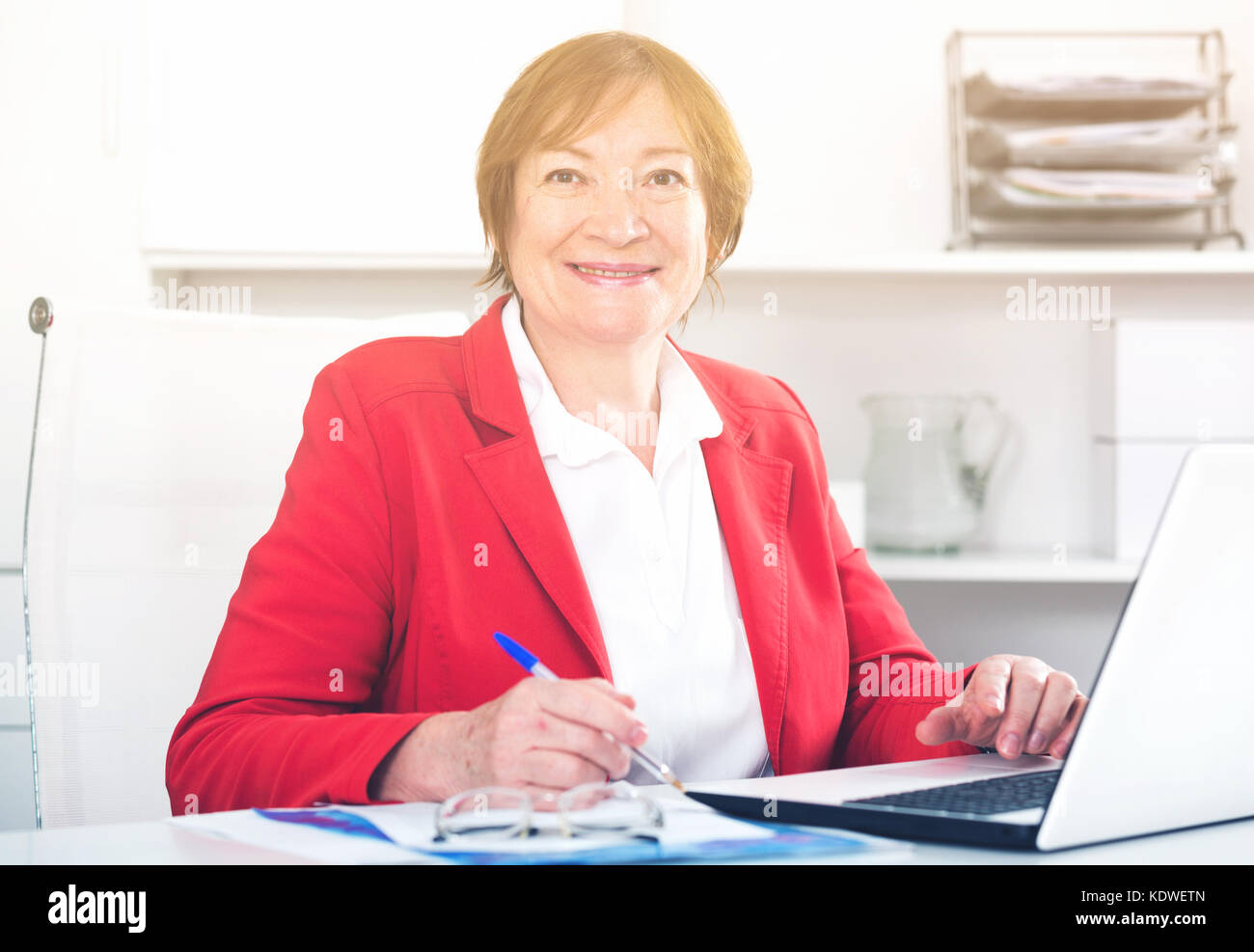 Female employee having a productive day at work in office Stock Photo ...