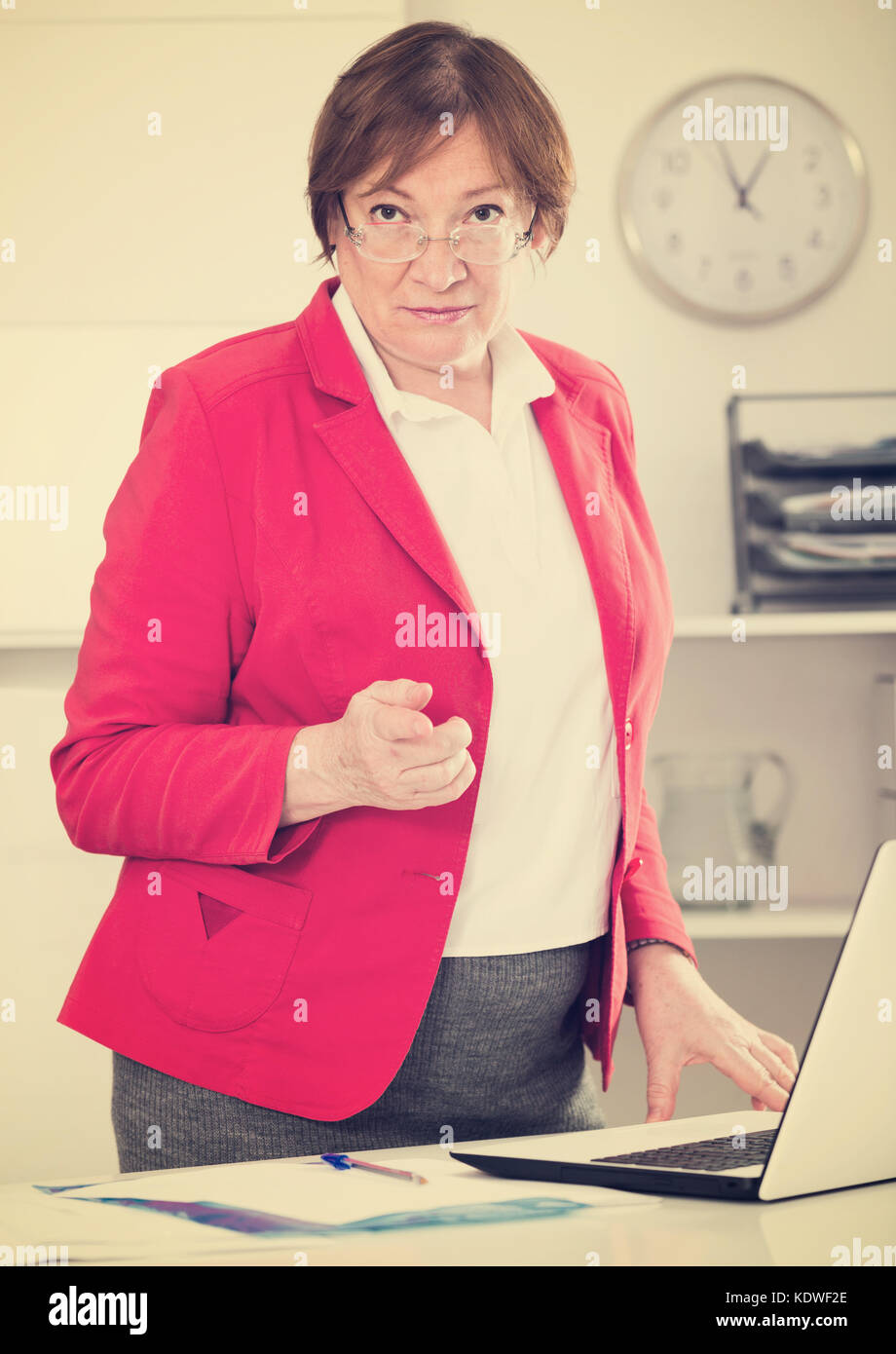 Smiling woman manager waiting for clients in her office Stock Photo - Alamy
