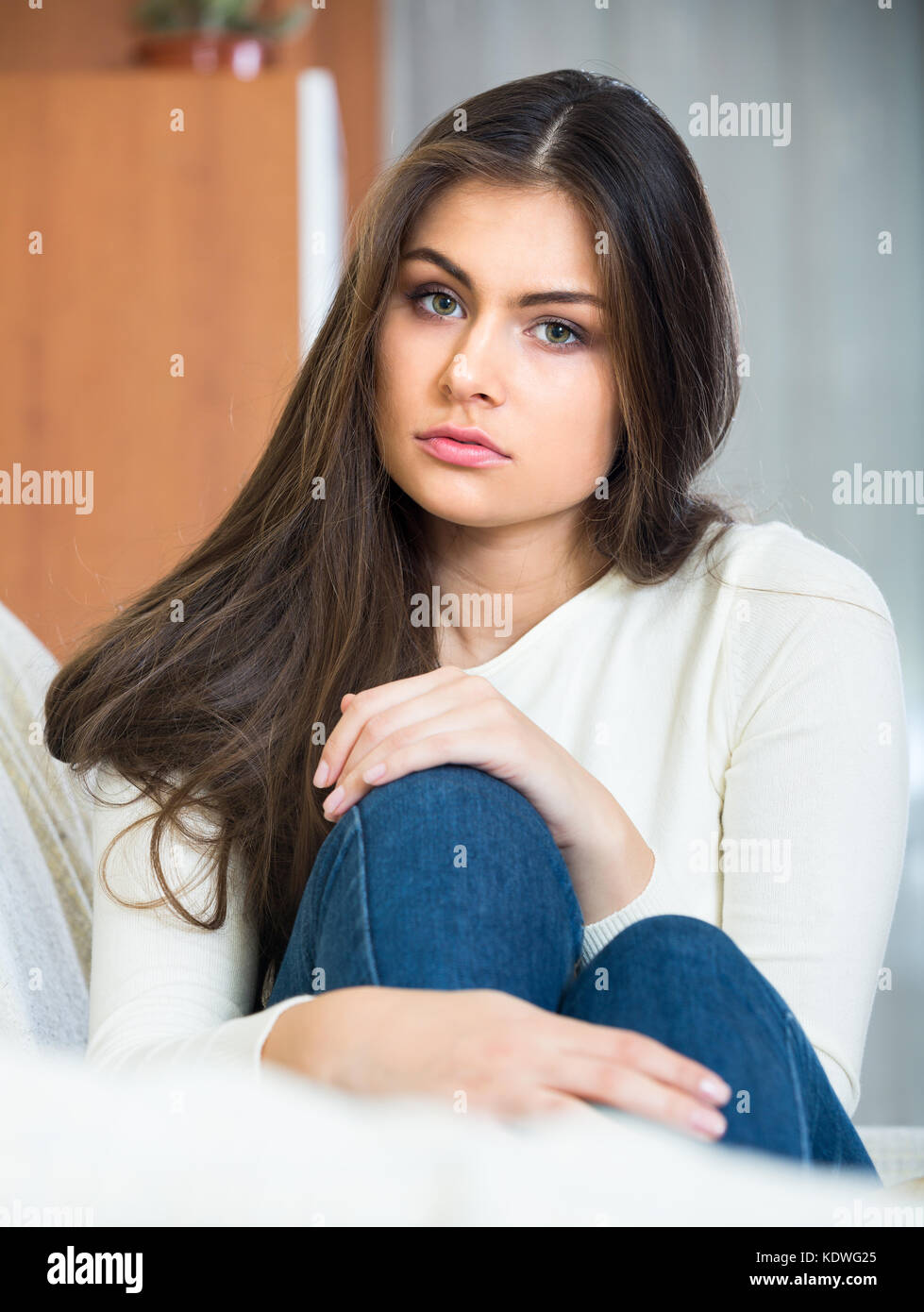 Portrait of sad young woman suffering being lonely at home Stock Photo ...