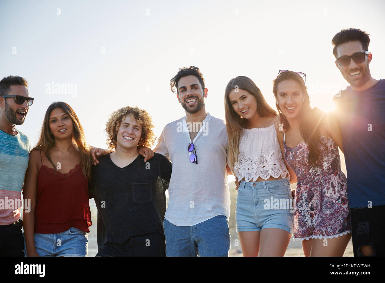 Portrait of group of happy friends standing together in sunlight Stock ...