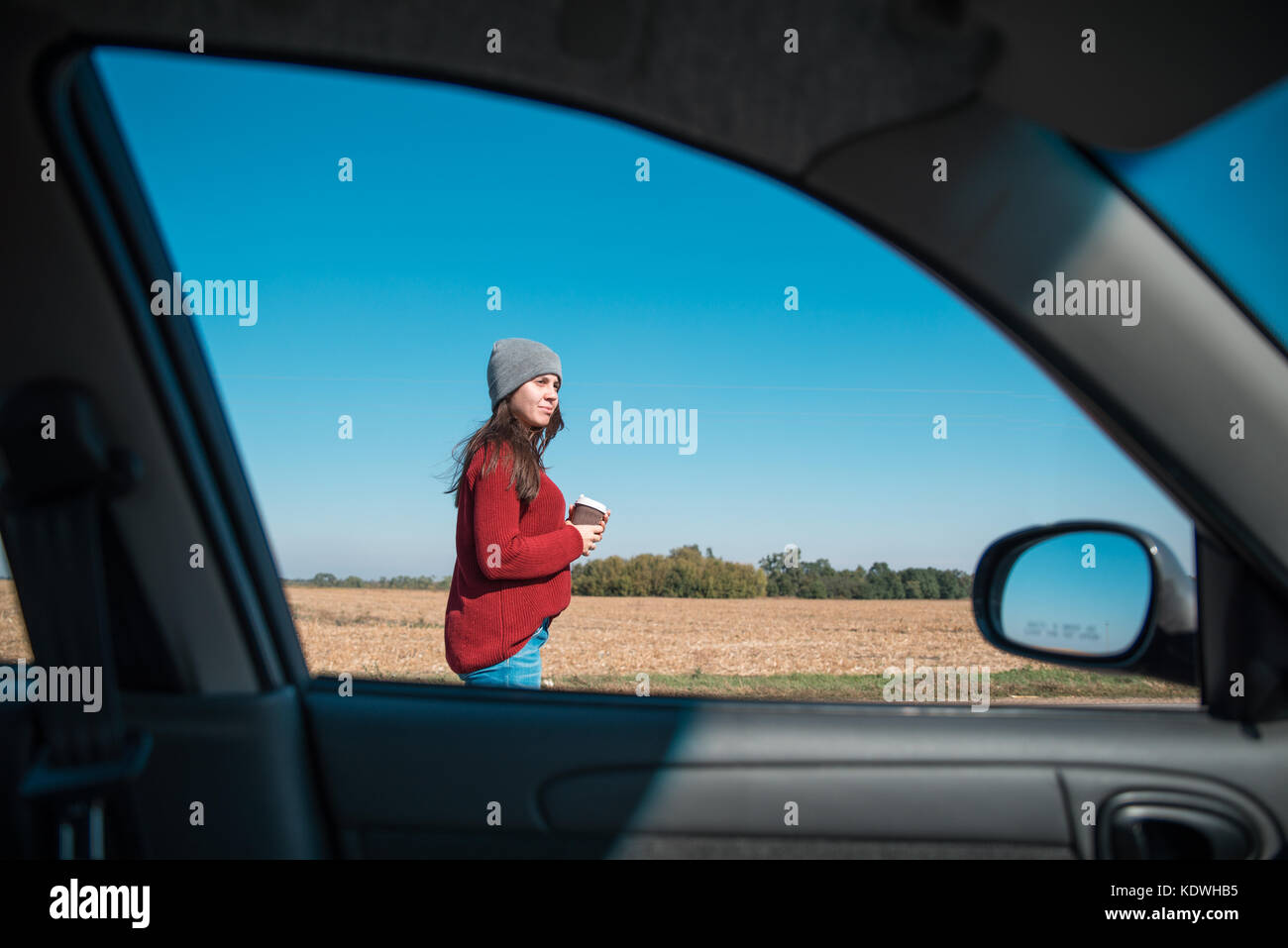 woman opening car door on highway Stock Photo - Alamy