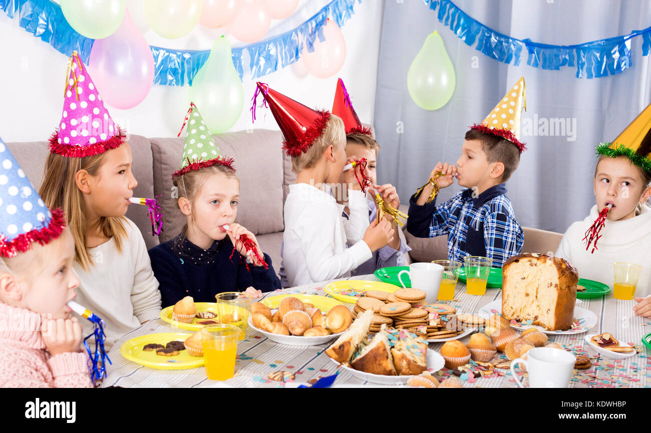 Group of children having fun during friend’s birthday party Stock Photo ...