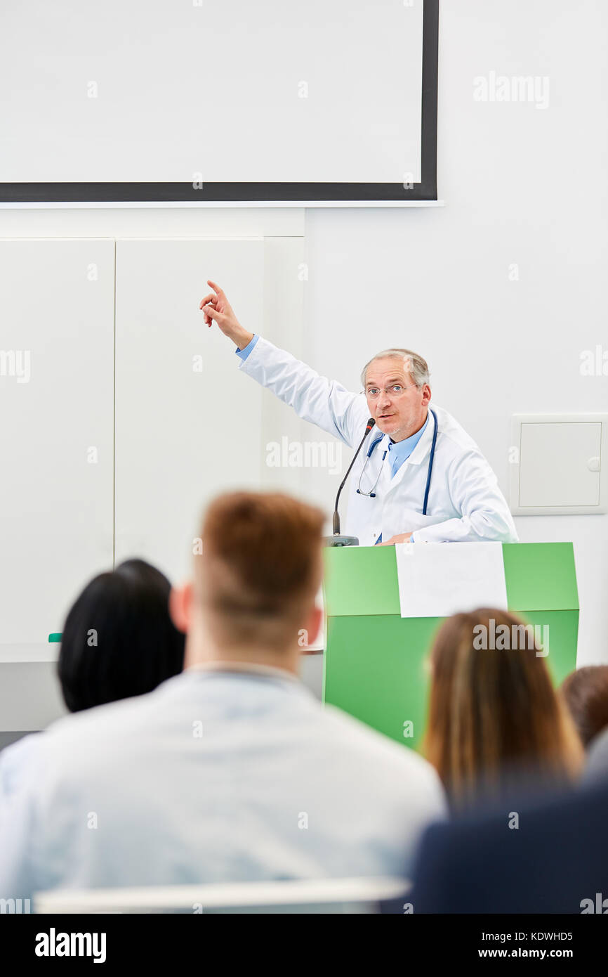 Senior as lecturer in medicine lecture at medical uni Stock Photo - Alamy