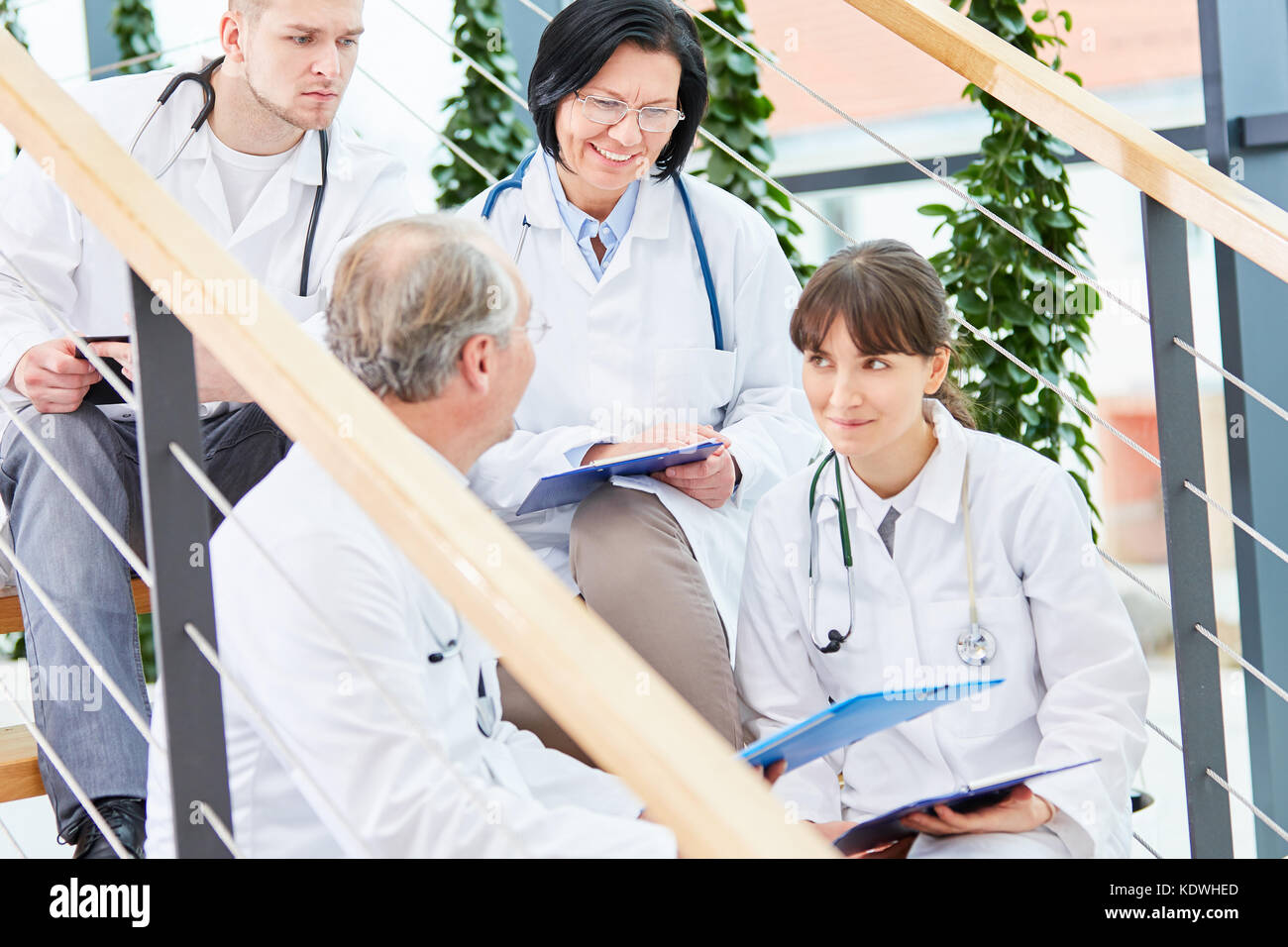 Experienced doctors at clinic with young apprentice Stock Photo - Alamy