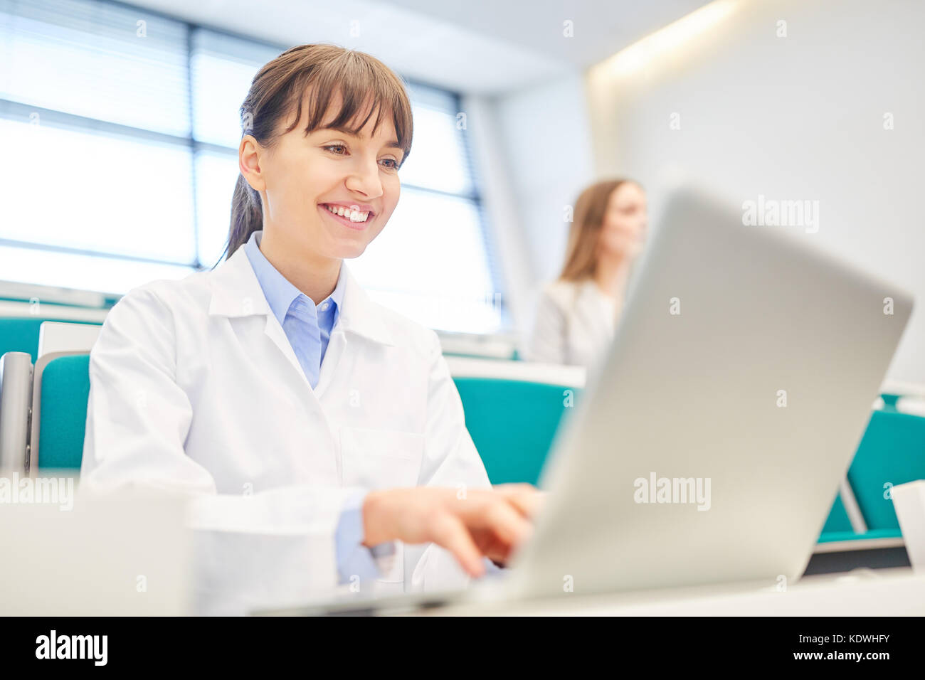 Young student as medicine apprentice study with laptop in medical ...