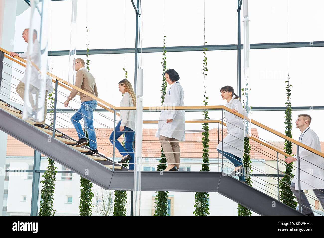 Hospital group of doctors as team walk together Stock Photo - Alamy