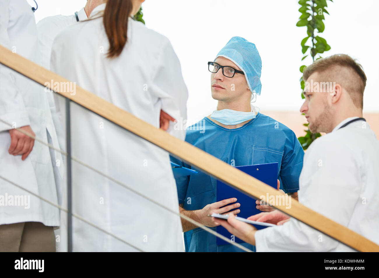 Young surgeon plan surgery with team of doctors Stock Photo - Alamy