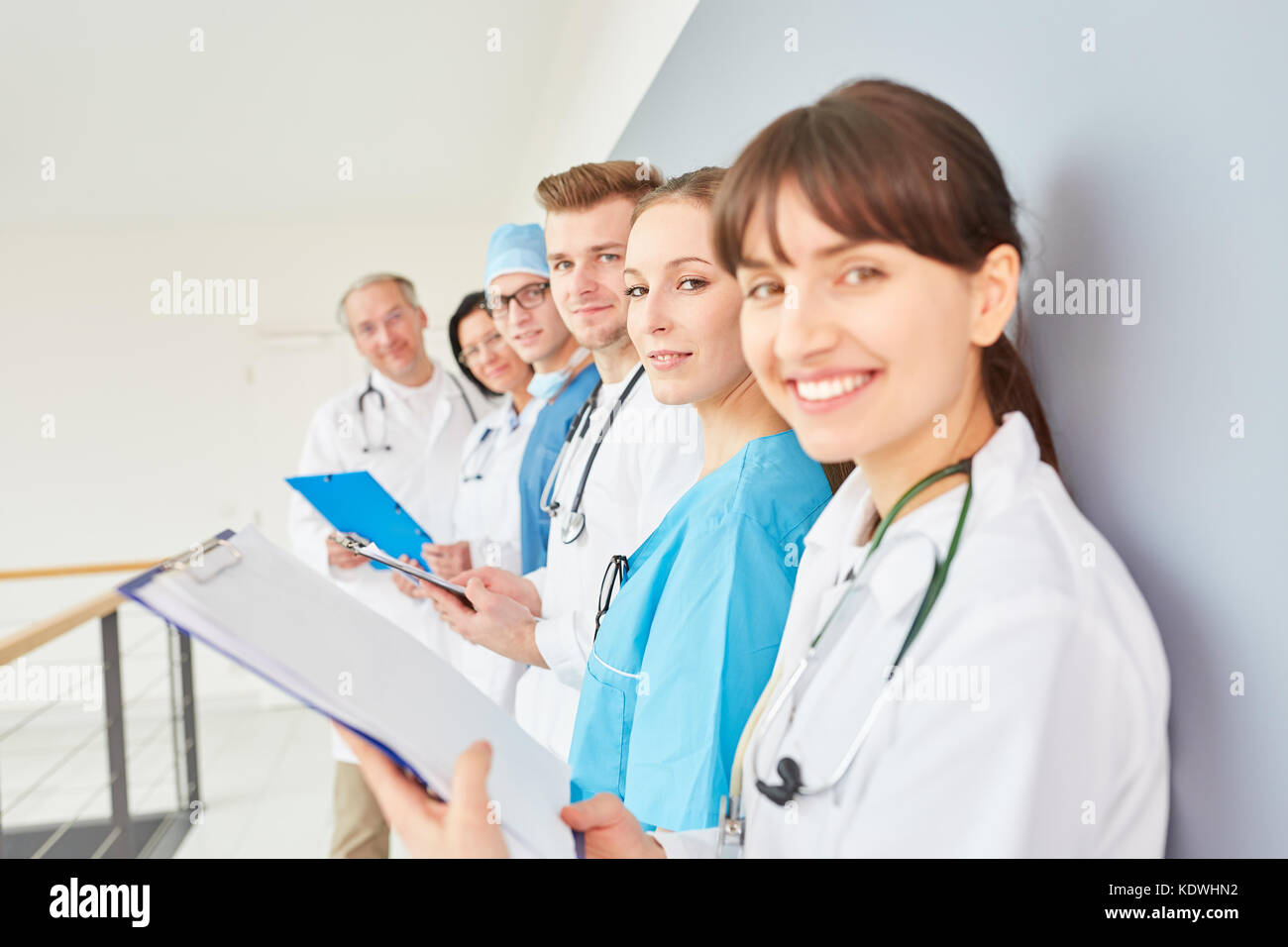 Woman in apprenticeship with team of doctors in clinic Stock Photo - Alamy
