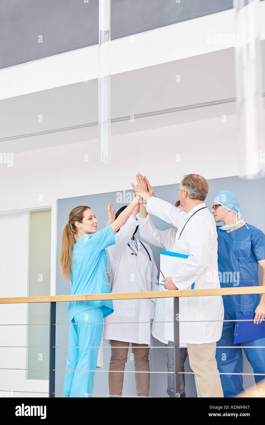High Five with team of doctors make team building excercise Stock Photo ...