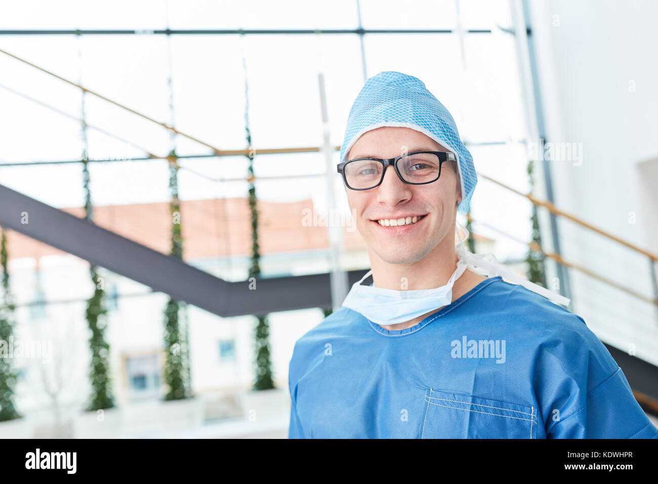 Young man as intensive care unit surgeon standing with joy Stock Photo ...