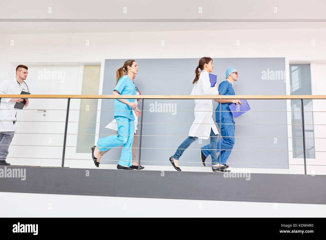 Emergency service team run fast as team of doctors Stock Photo - Alamy