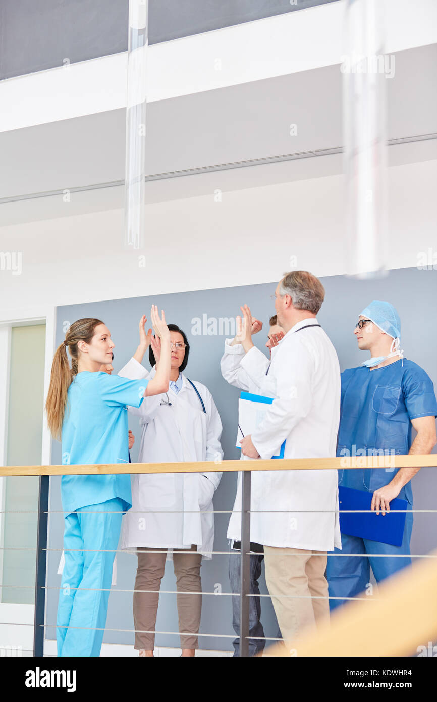 Team of doctors High Five as team building or motivation Stock Photo ...