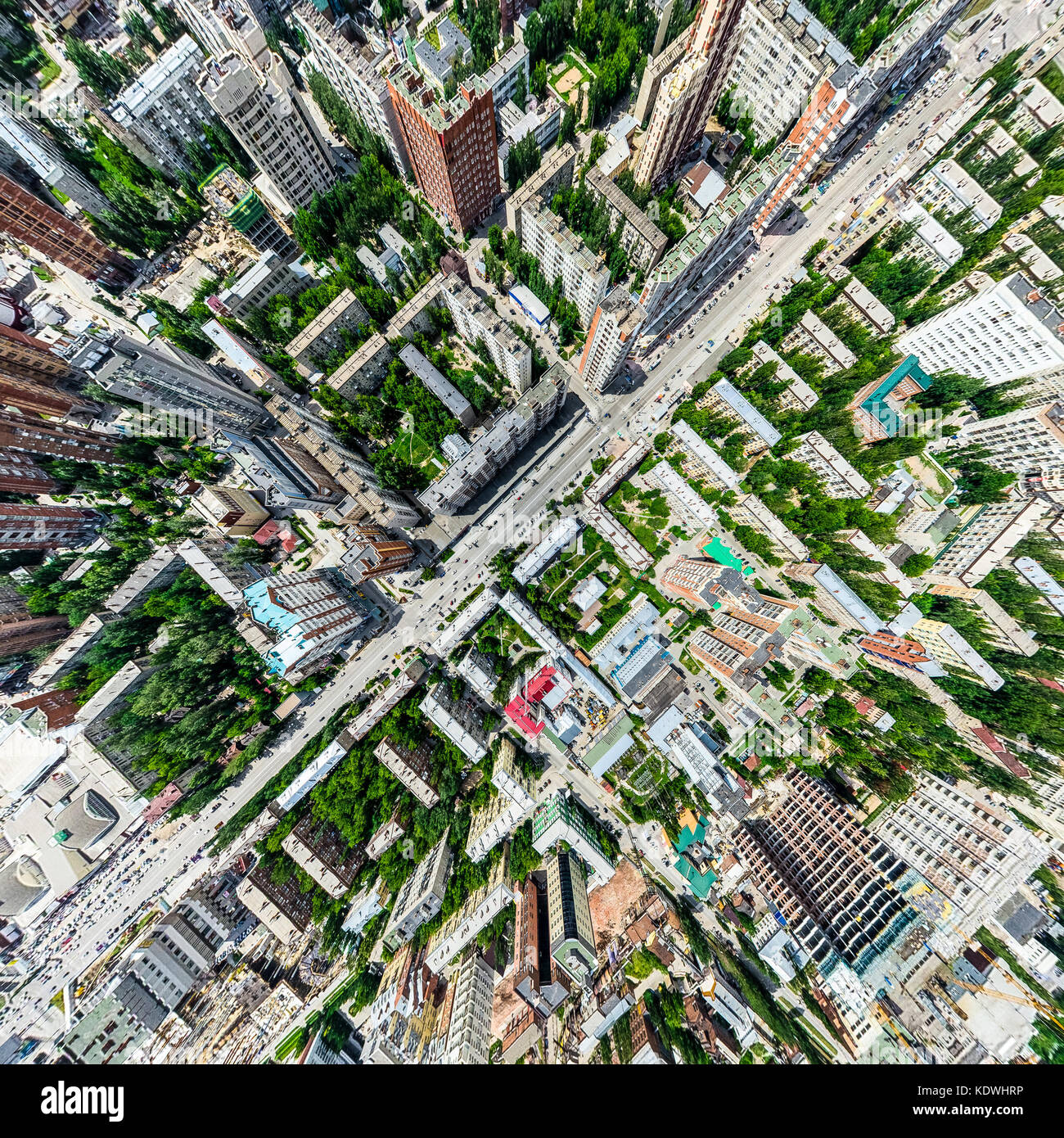 Aerial city view with crossroads and roads, houses, buildings, parks ...