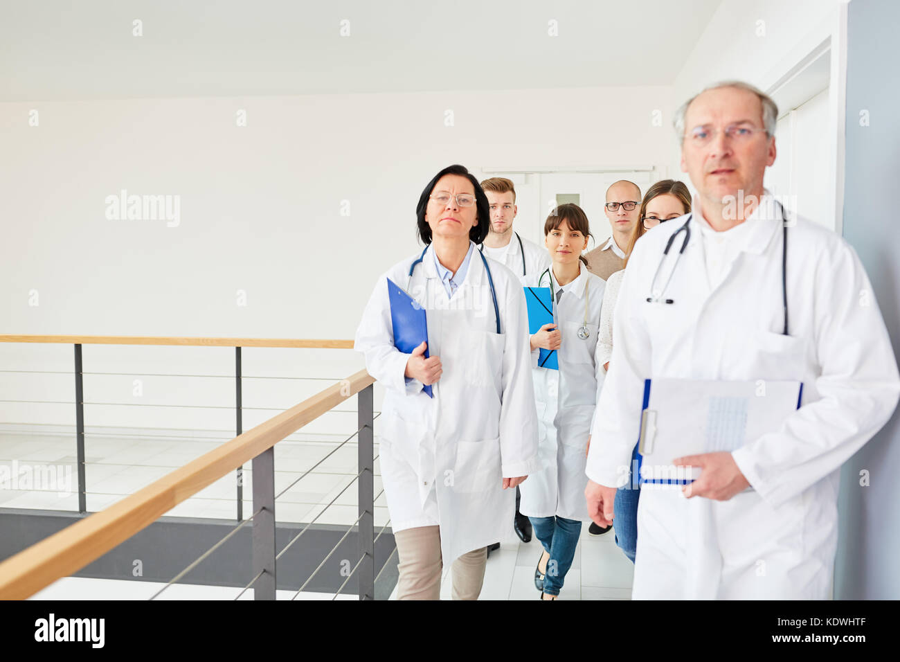 Team or group of doctors and nurse in hospital with boss Stock Photo ...