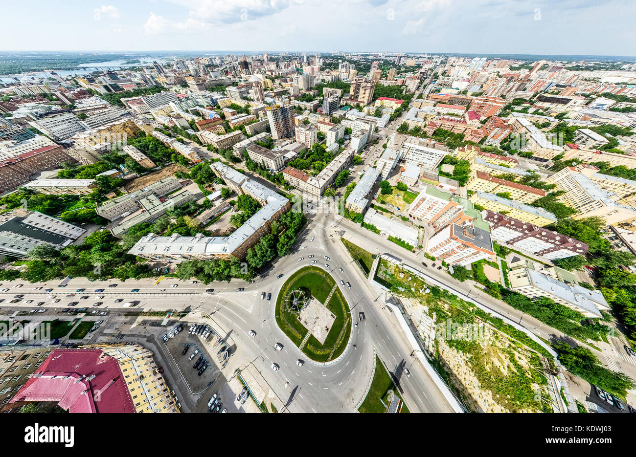 Aerial city view with crossroads and roads, houses, buildings, parks ...