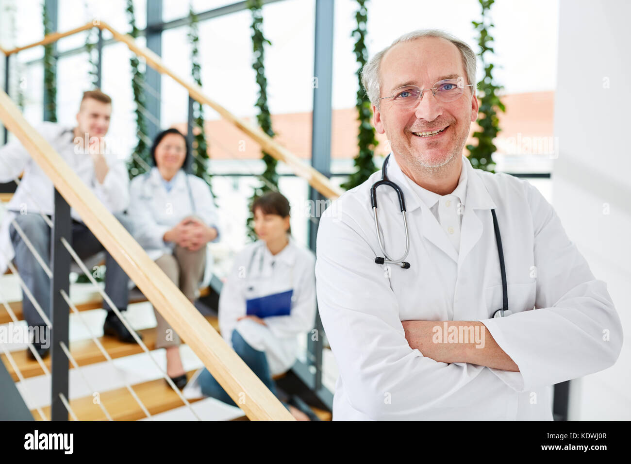 Senior as successful doctor or chief physician with self-confidence ...