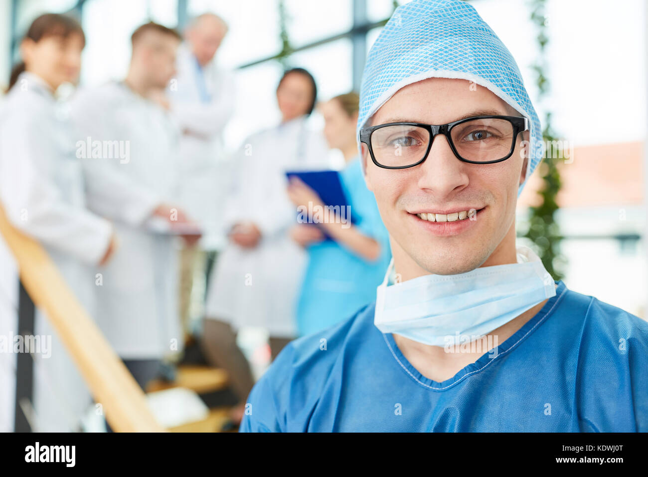 Young physician as surgeon of intensive Care team of doctors Stock ...