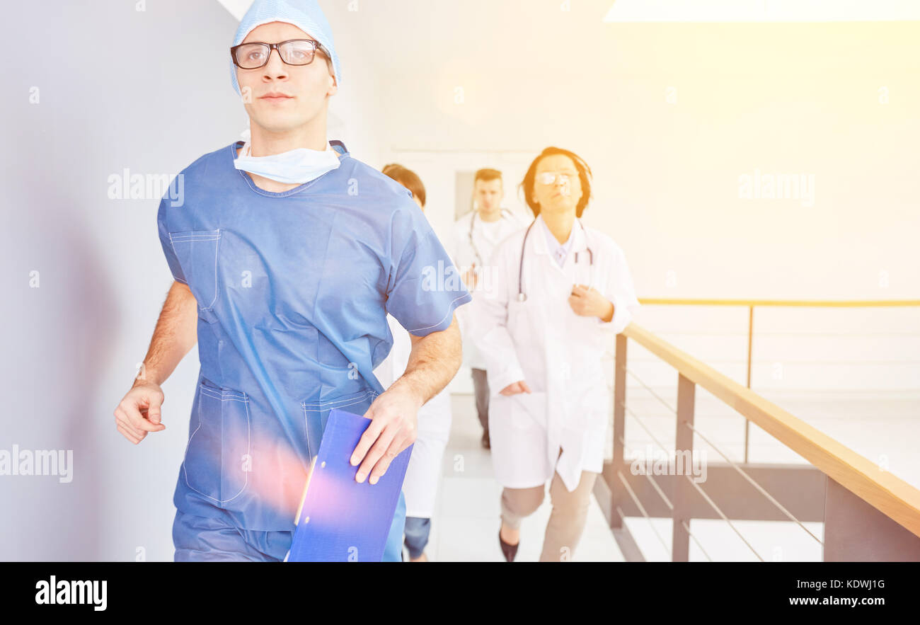 Doctor and team run to emergency in hospital Stock Photo - Alamy