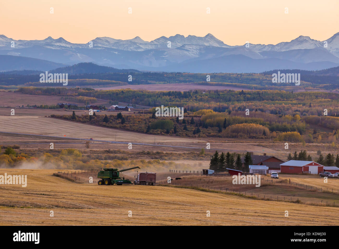 The clouds catch the sunset above the Foothills west of Calgary where ...