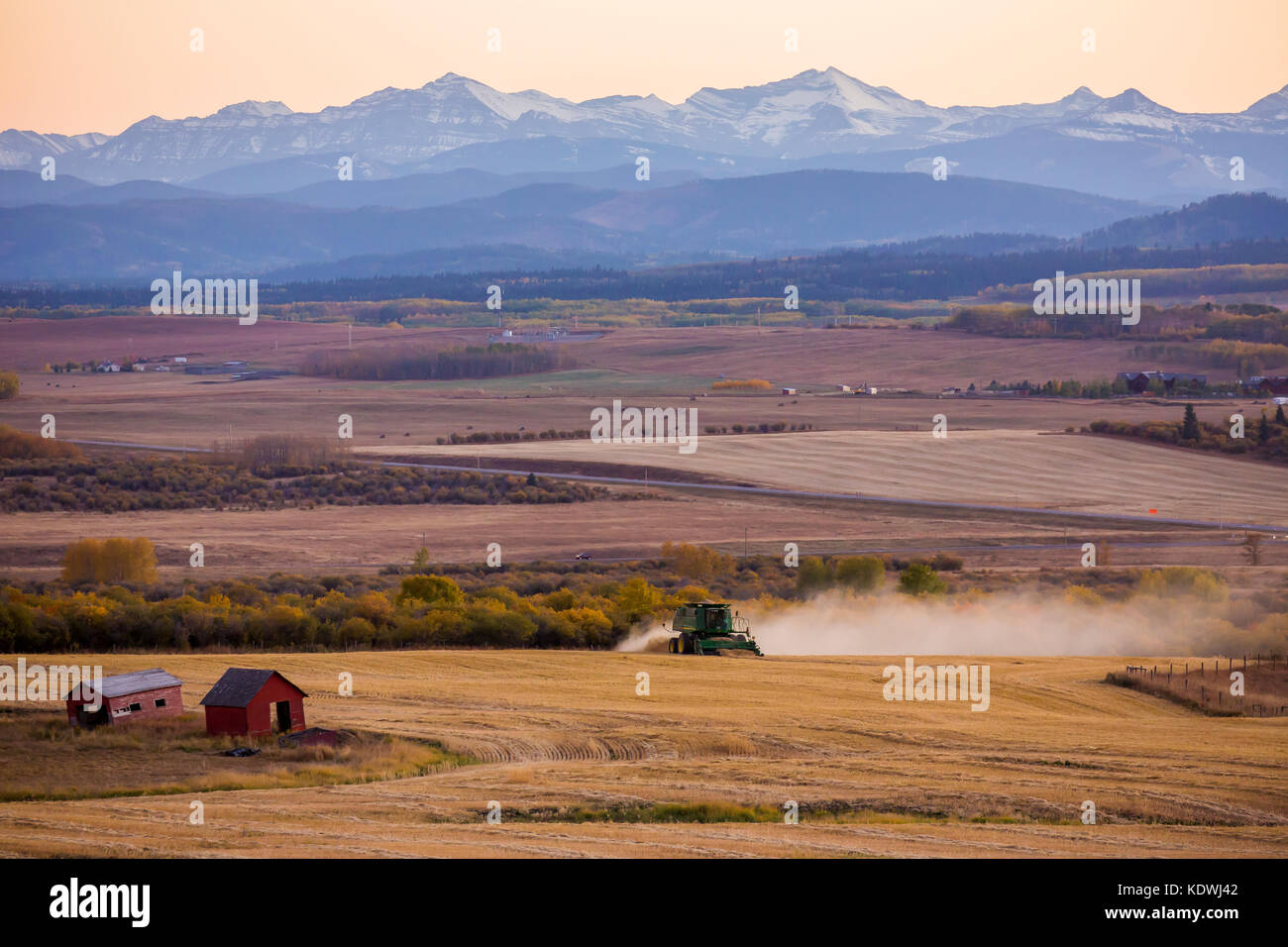 The clouds catch the sunset above the Foothills west of Calgary where ...