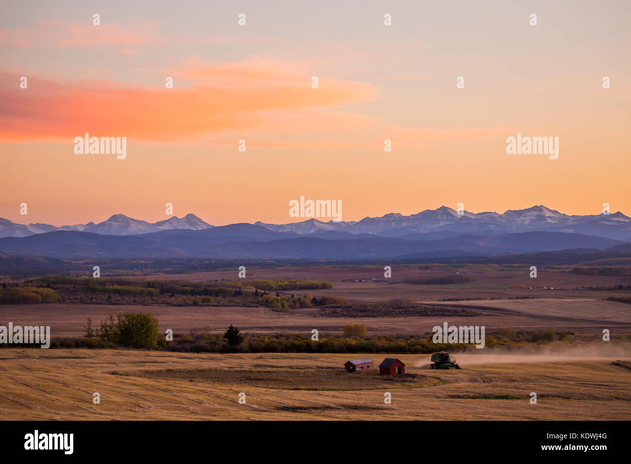 The clouds catch the sunset above the Foothills west of Calgary where ...