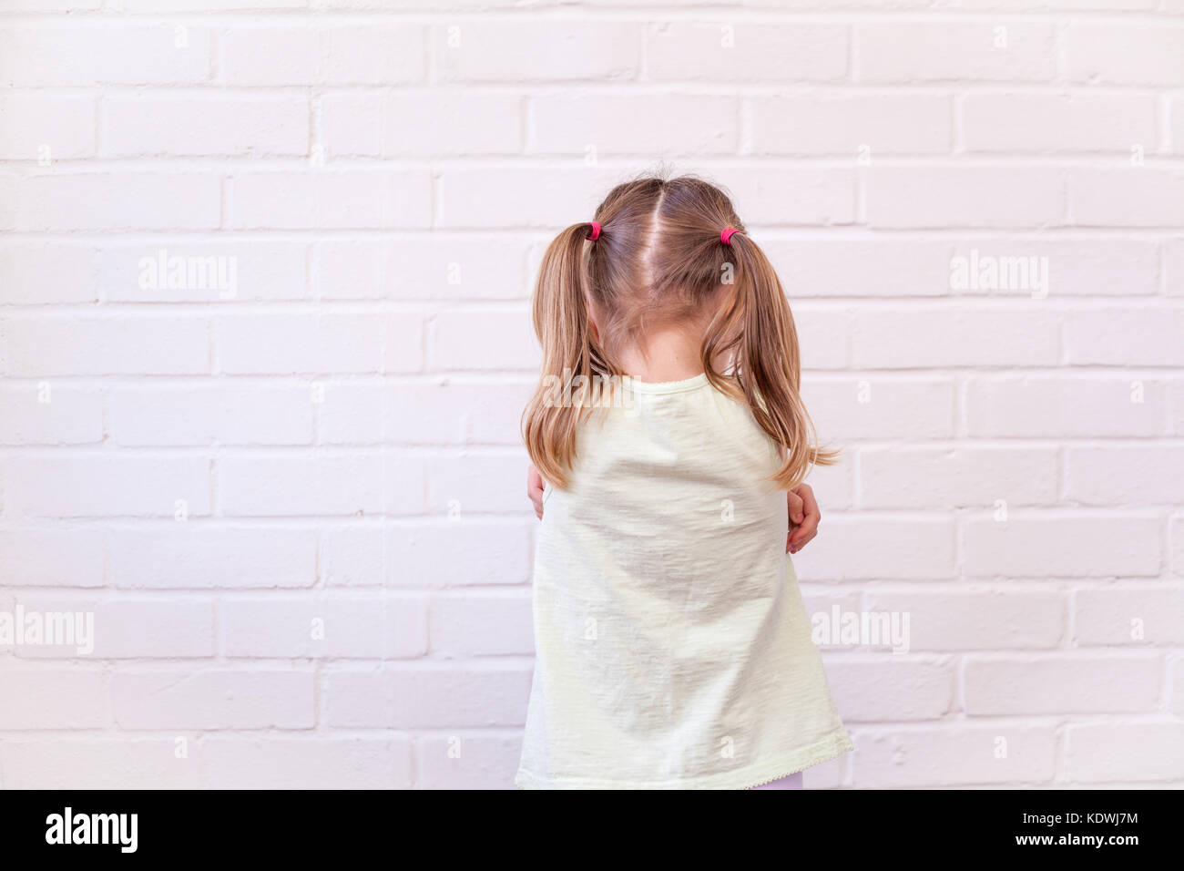 Back pose small girl in hi-res stock photography and images - Alamy