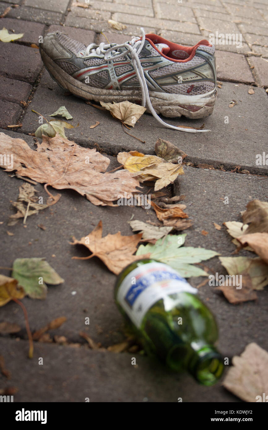 trainer shoe and alcohol on a street Stock Photo - Alamy