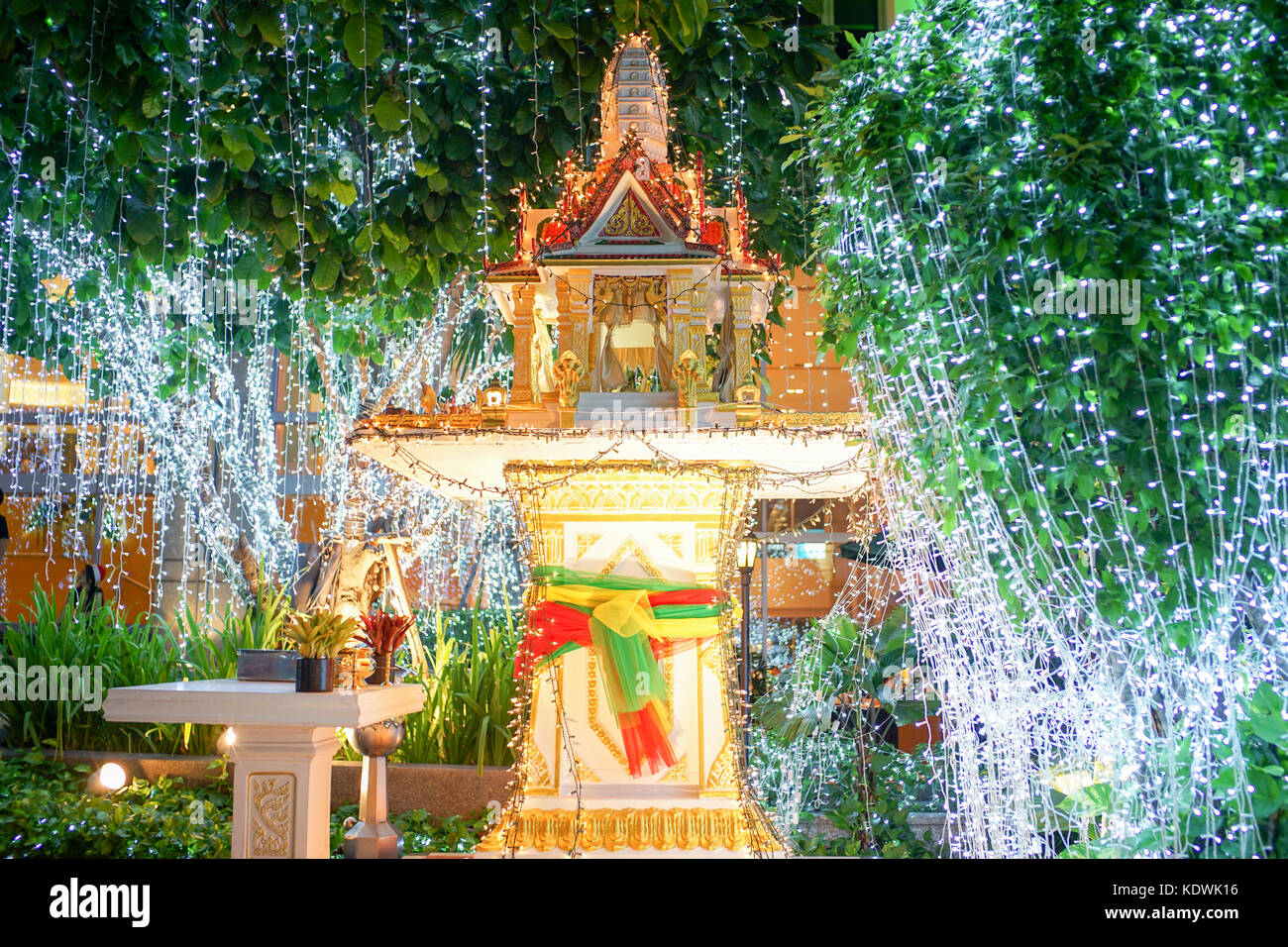 The shrine of Thailand at night is adorned with LED lights on the tree ...