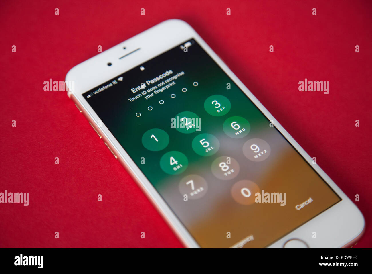 Apple iPhone 8 model login screen against a red colour background Stock ...