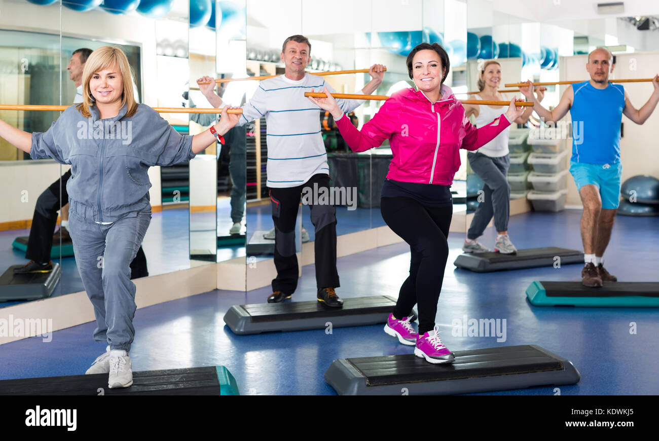 Group of happy american people exercising in a fitness club Stock Photo ...