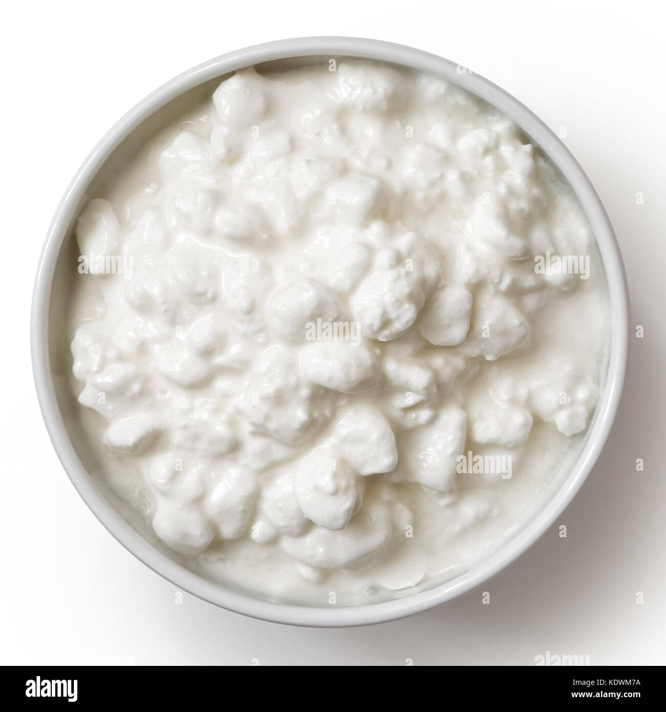 White ceramic bowl of chunky cottage cheese isolated on white from ...